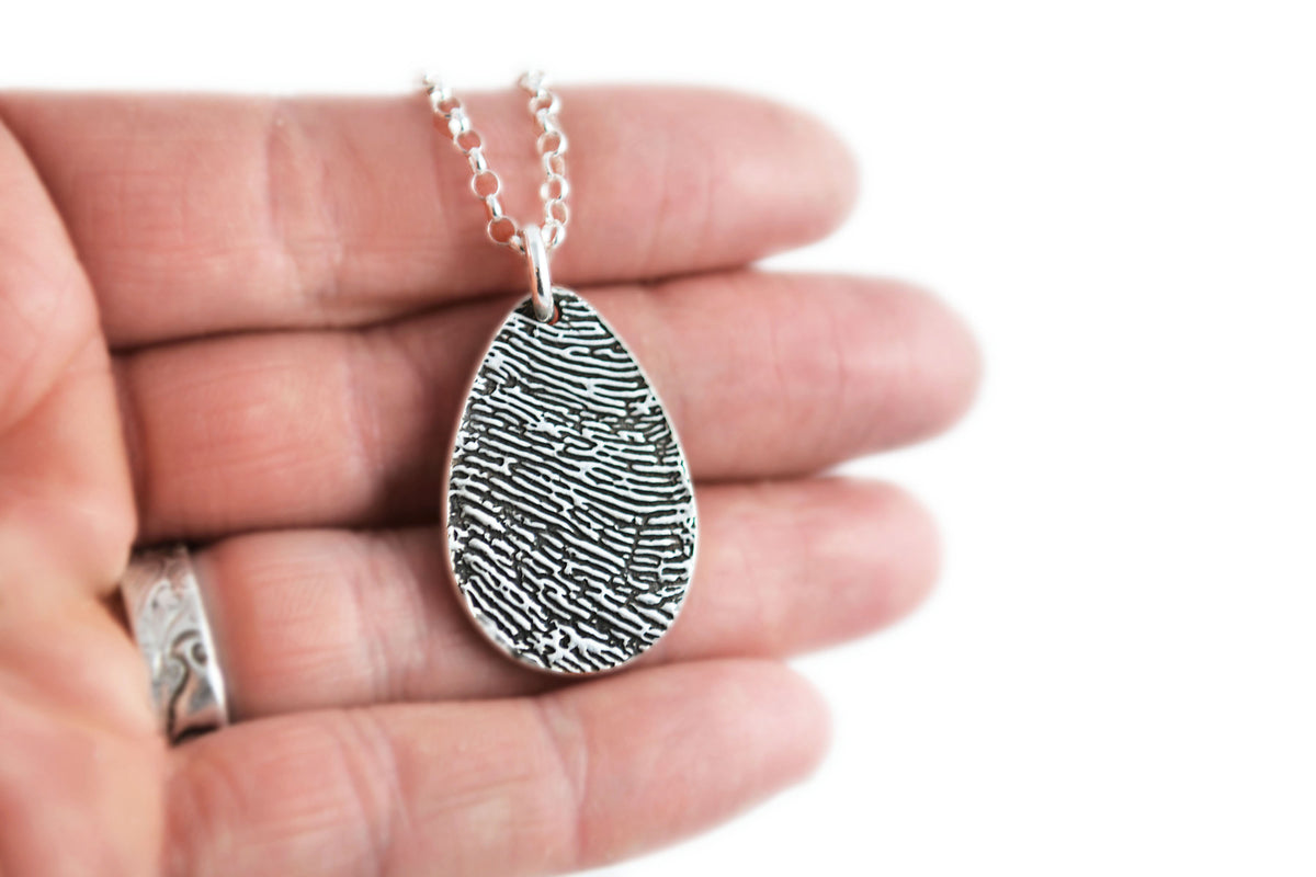Actual Writing Signature and Fingerprint on a Silver Teardrop Shape Pe ...